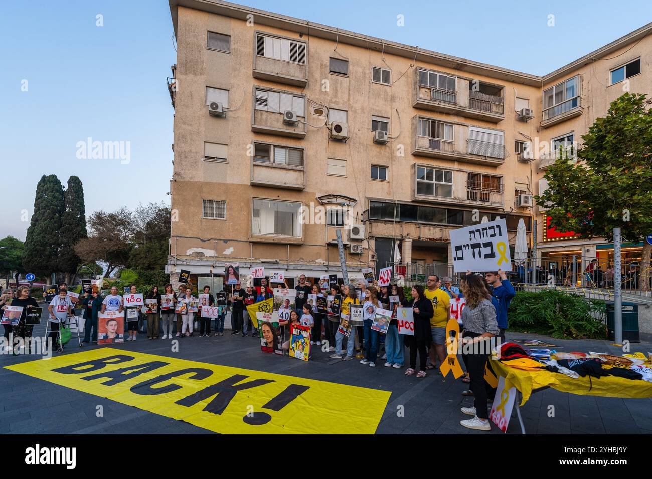 Haifa, Israel - November 09, 2024: People stand with hostage posters ...