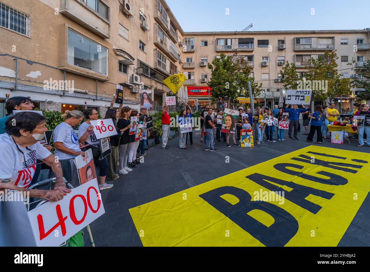 Haifa, Israel - November 09, 2024: People stand with hostage posters ...