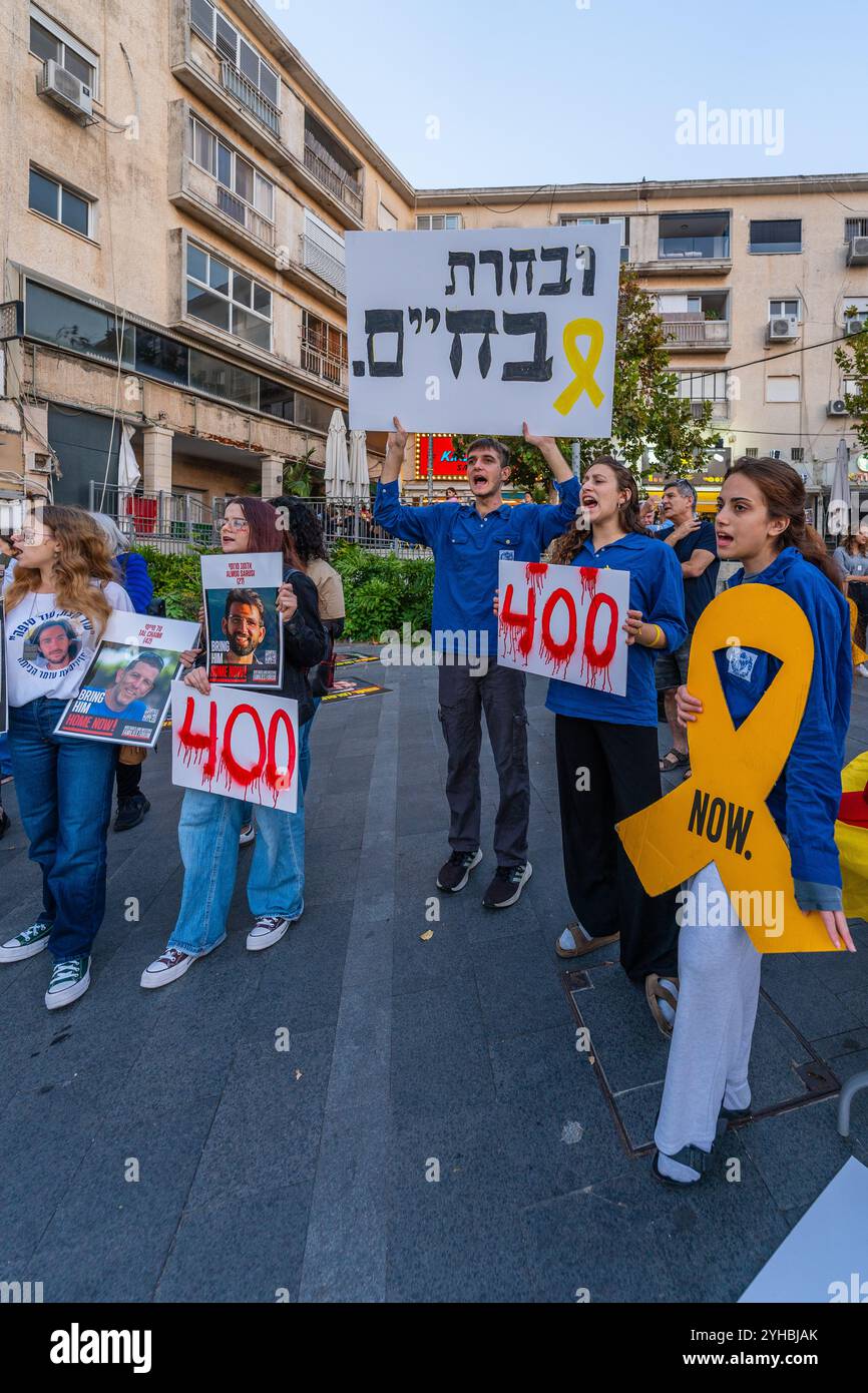 Haifa, Israel - November 09, 2024: People stand with hostage posters ...