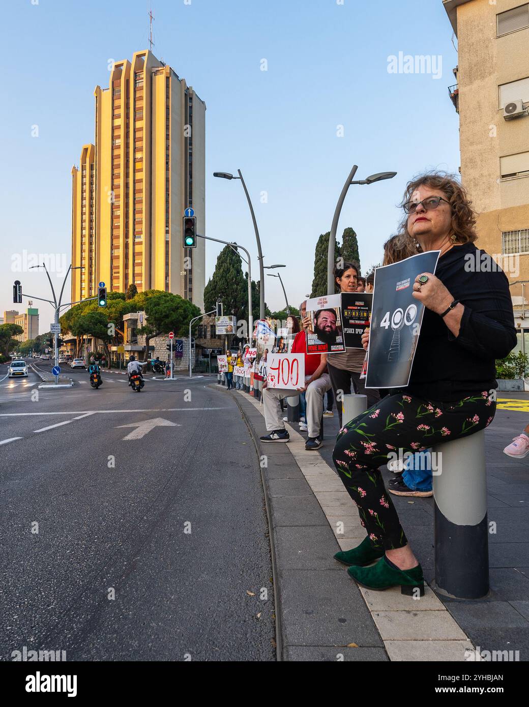 Haifa, Israel - November 09, 2024: People stand with hostage posters ...