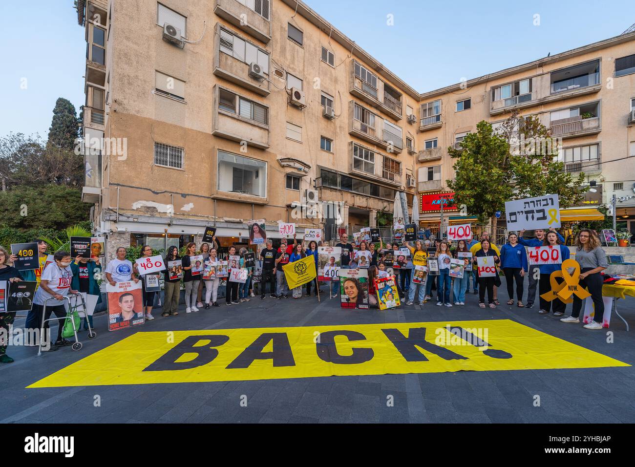 Haifa, Israel - November 09, 2024: People stand with hostage posters ...