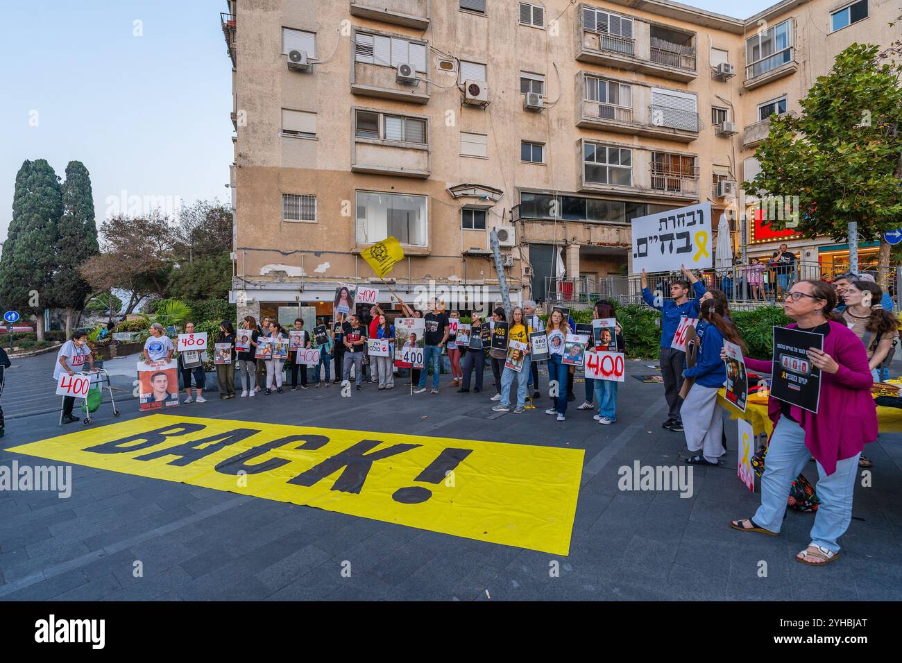 Haifa, Israel - November 09, 2024: People stand with hostage posters ...