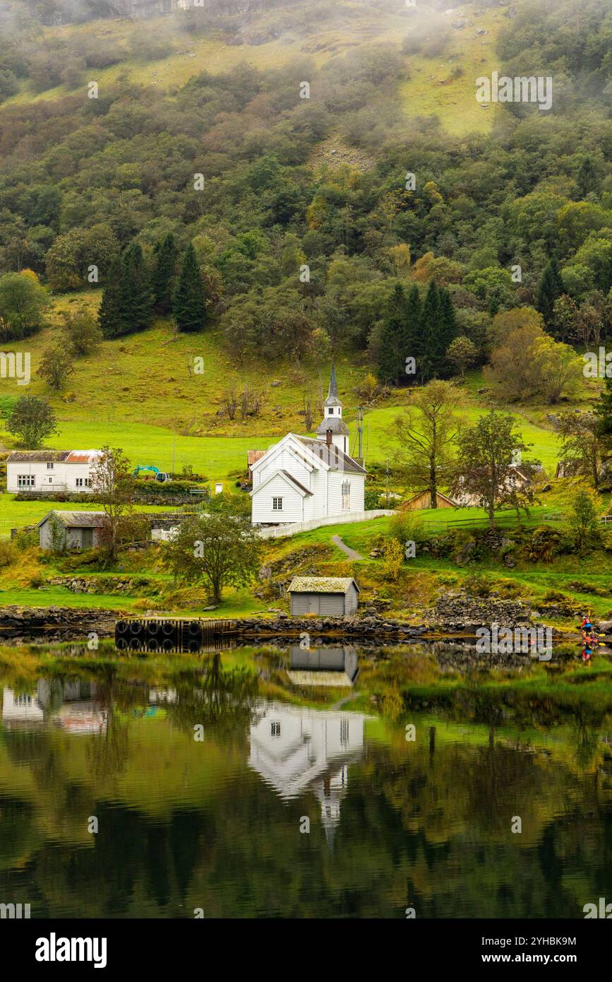The farming village of Dyrdal with its pretty white church on the shore ...
