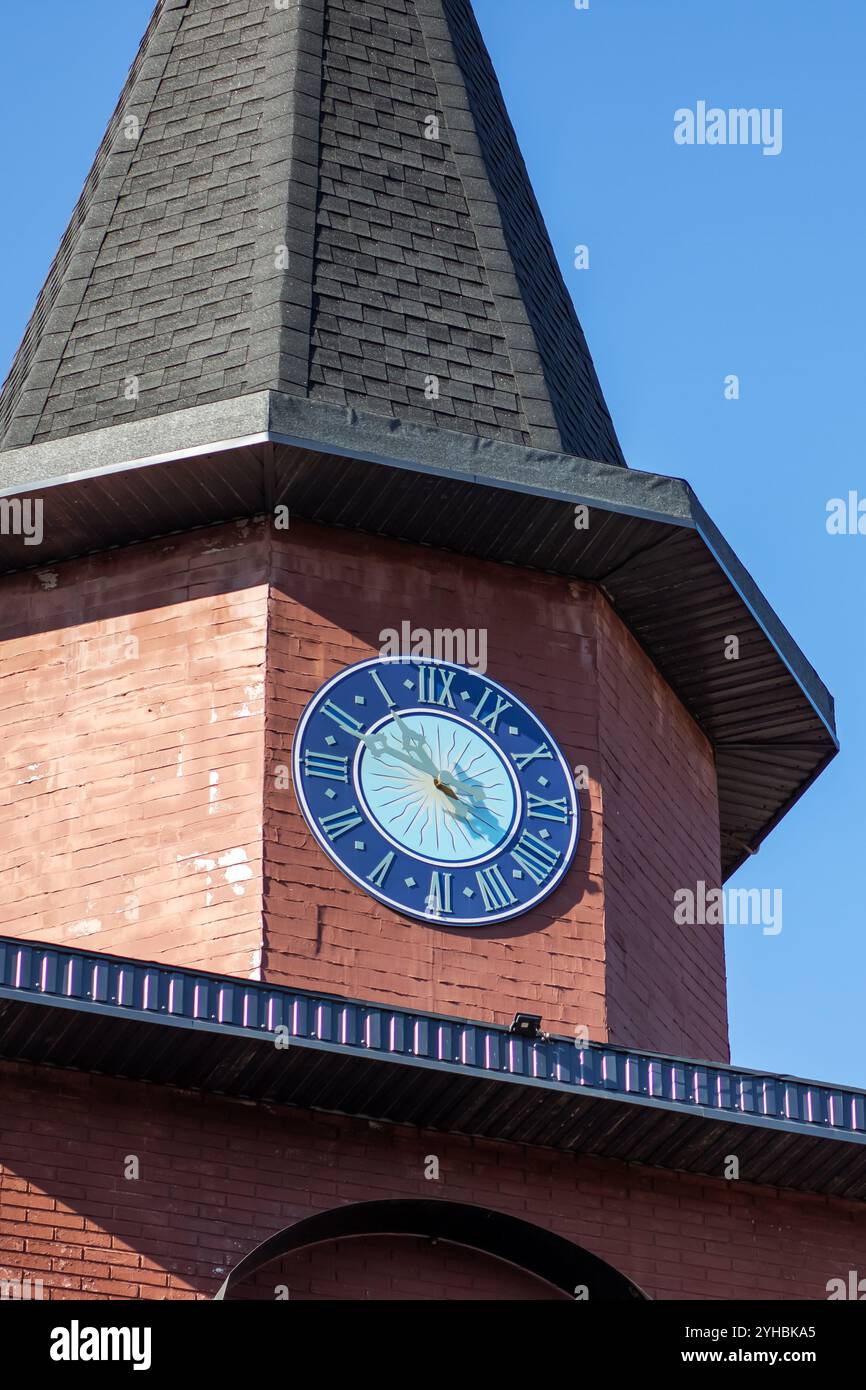 A breathtaking and stunning clock tower that features a vibrant blue ...