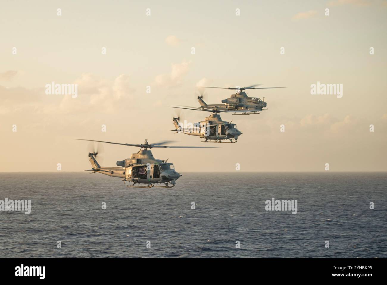 U.S. Marine Corps UH-1Y Venoms, left and center, and an AH-1Z Viper ...
