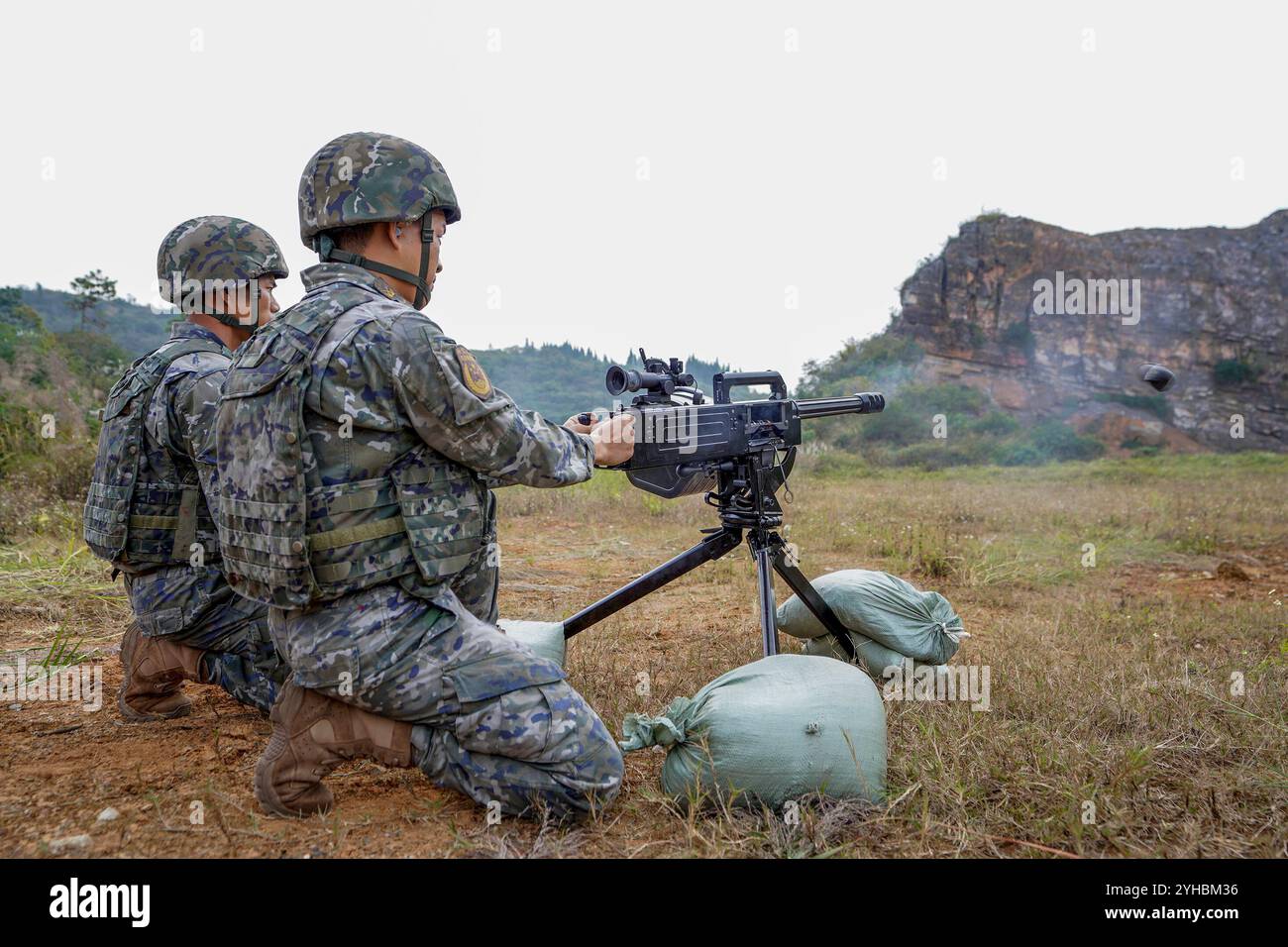 Qianxinan, China. 11th Nov, 2024. An operator fires live ammunition ...