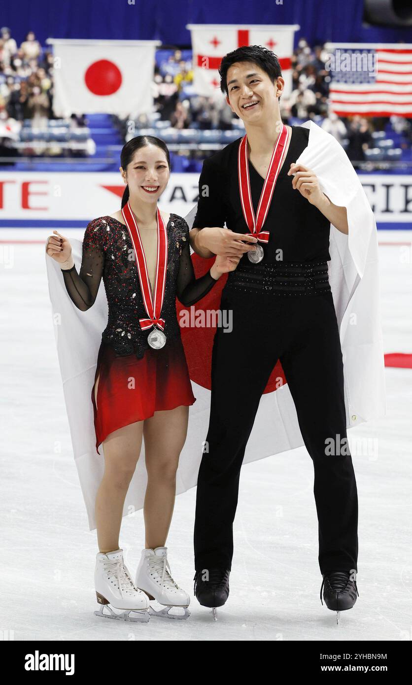 Japanese pair Riku Miura (L) and Ryuichi Kihara pose after winning ...