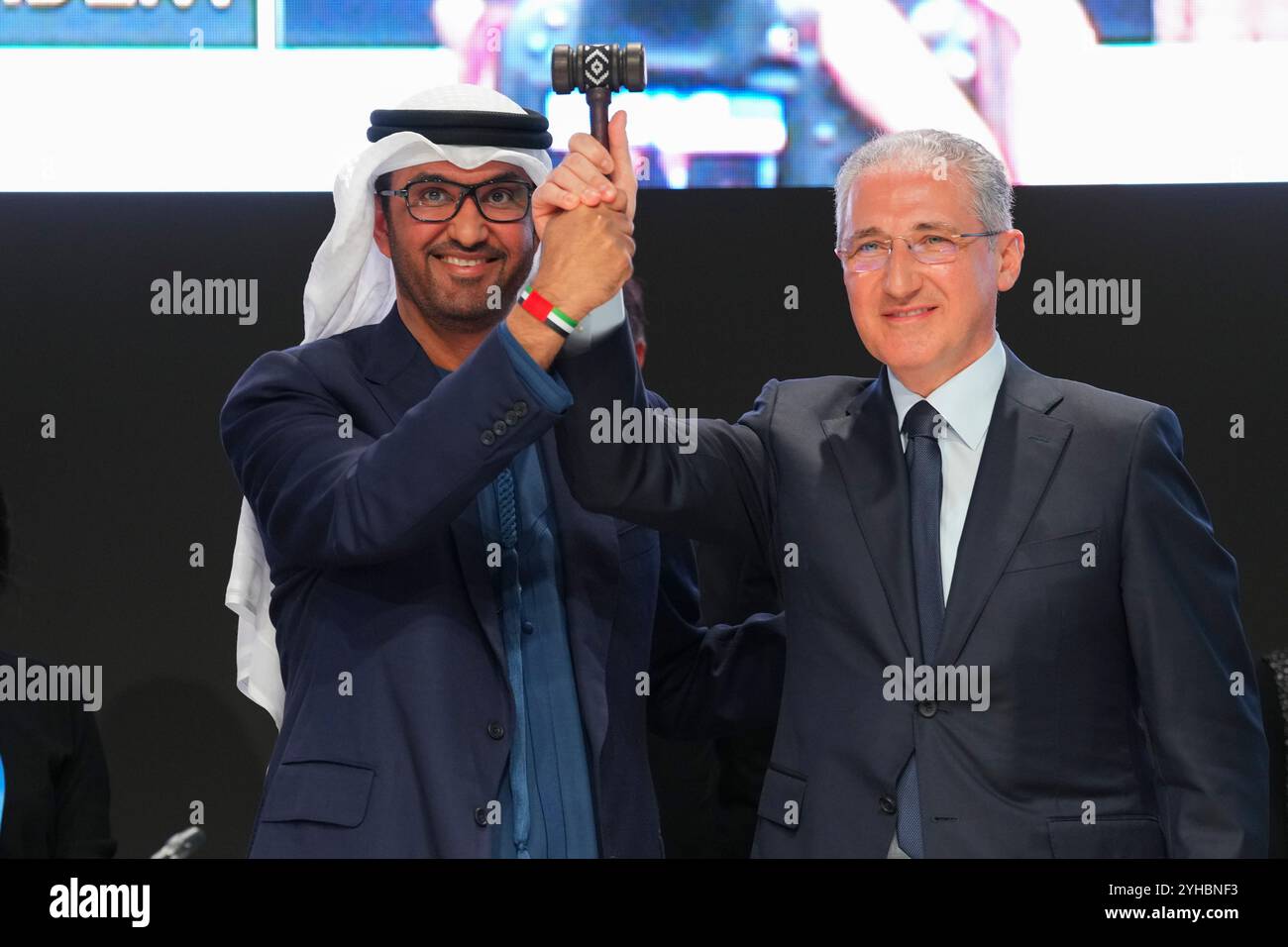 COP28 President Sultan al-Jaber, left, hands over the gavel to Mukhtar Babayev, COP29 President ...