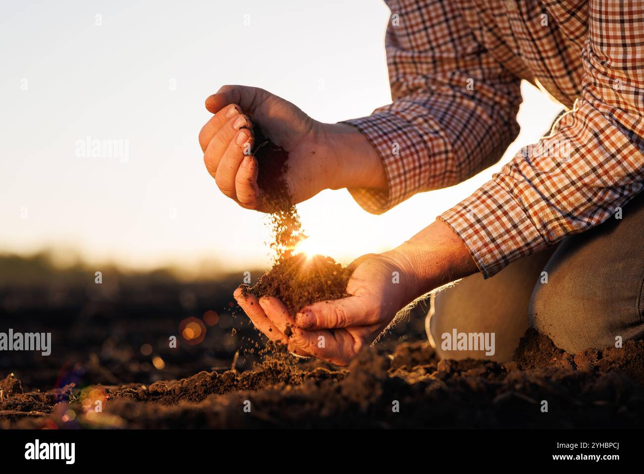 Farmer touching dirt in hands hi-res stock photography and images - Alamy