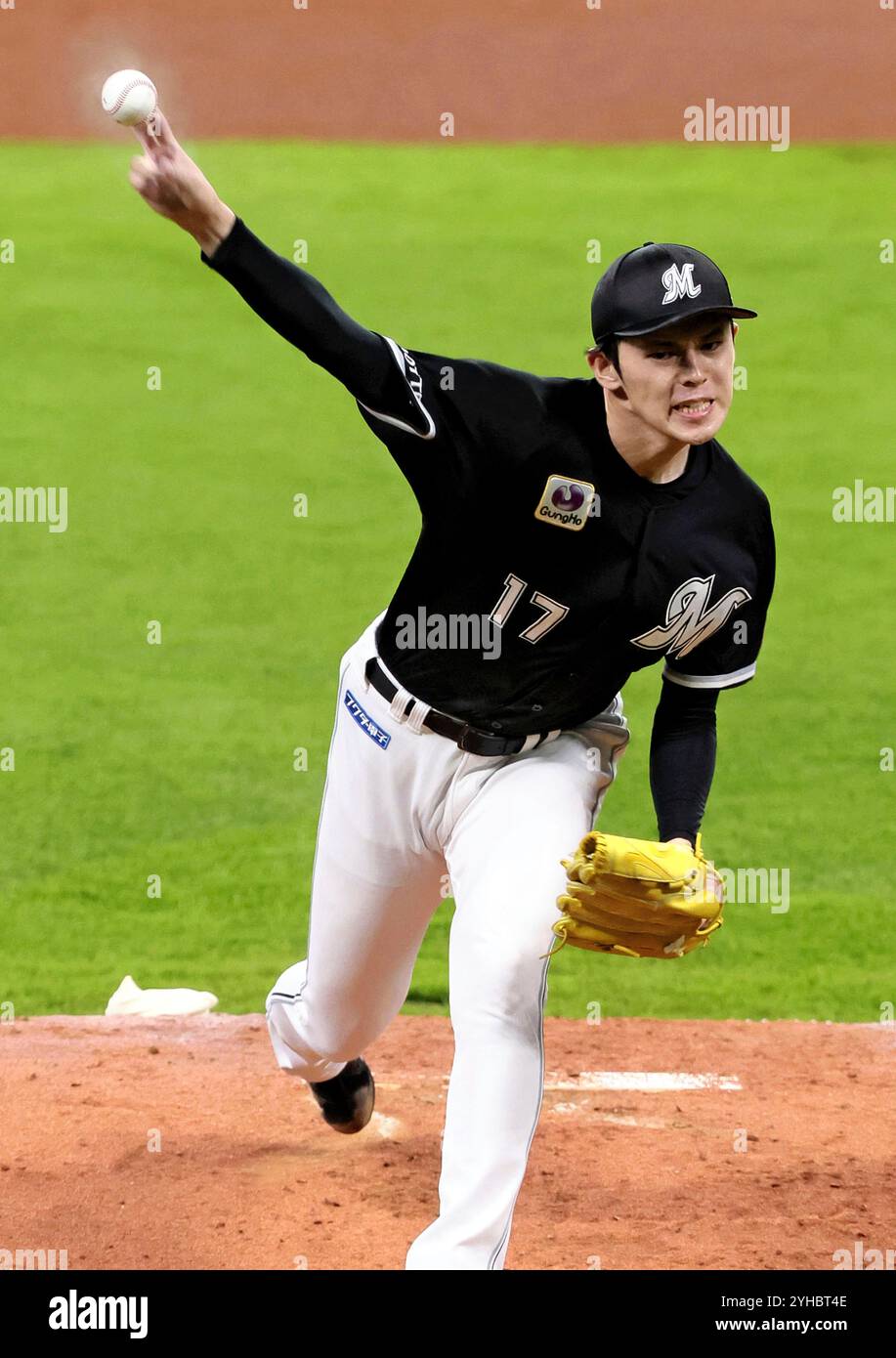 FILE: Japanese pitcher Roki Sasaki of Chiba Lotte Marines throws a ball ...