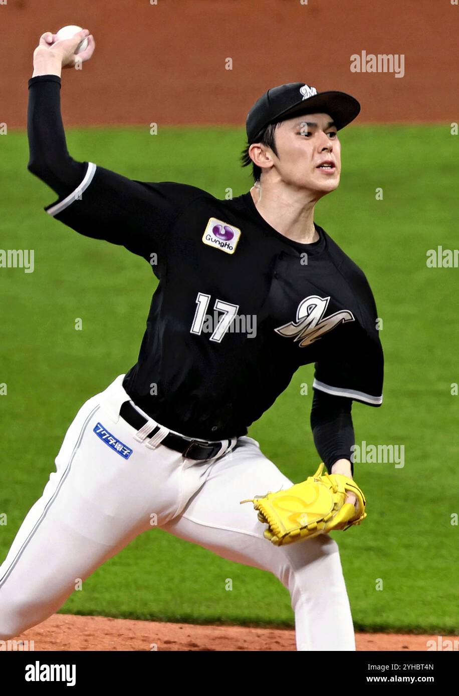 FILE: Japanese pitcher Roki Sasaki of Chiba Lotte Marines throws a ball ...