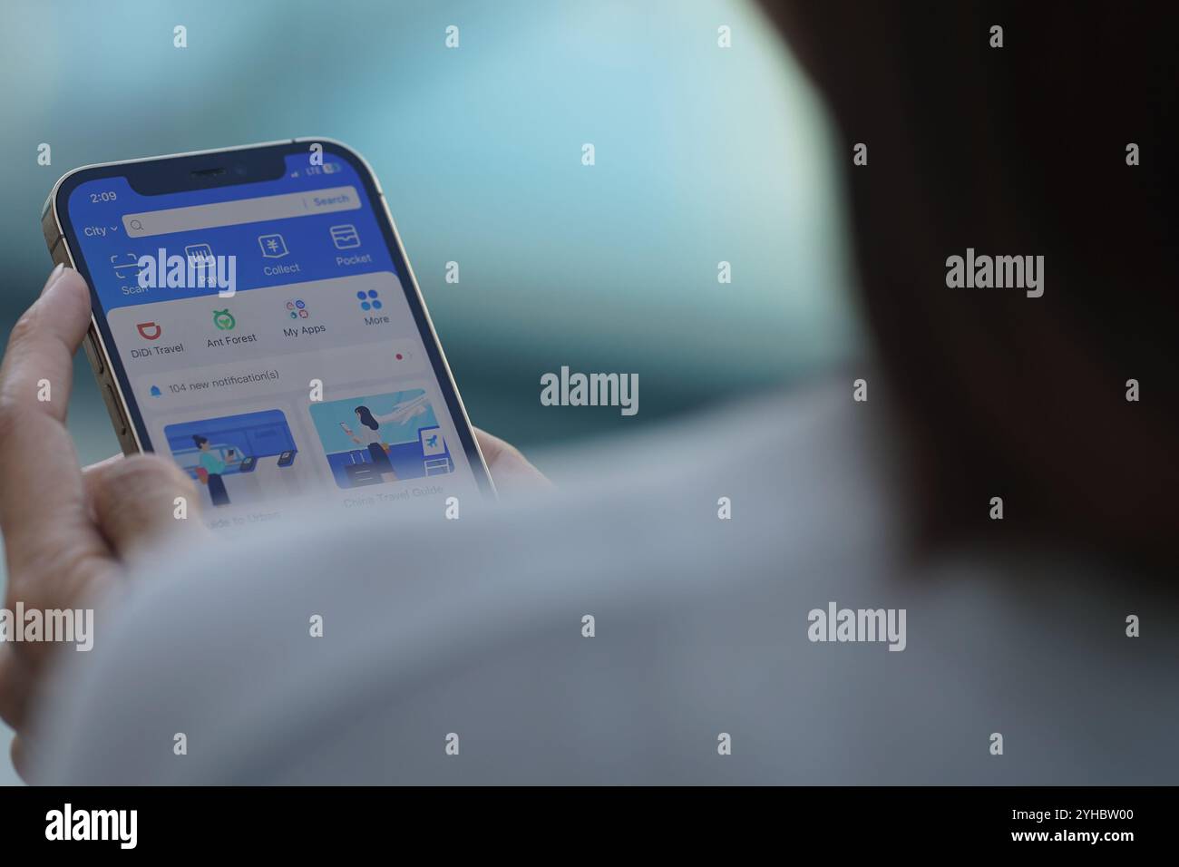 China. 9th Nov, 2024. In this photo illustration, A woman browses the Alipay app on her ...