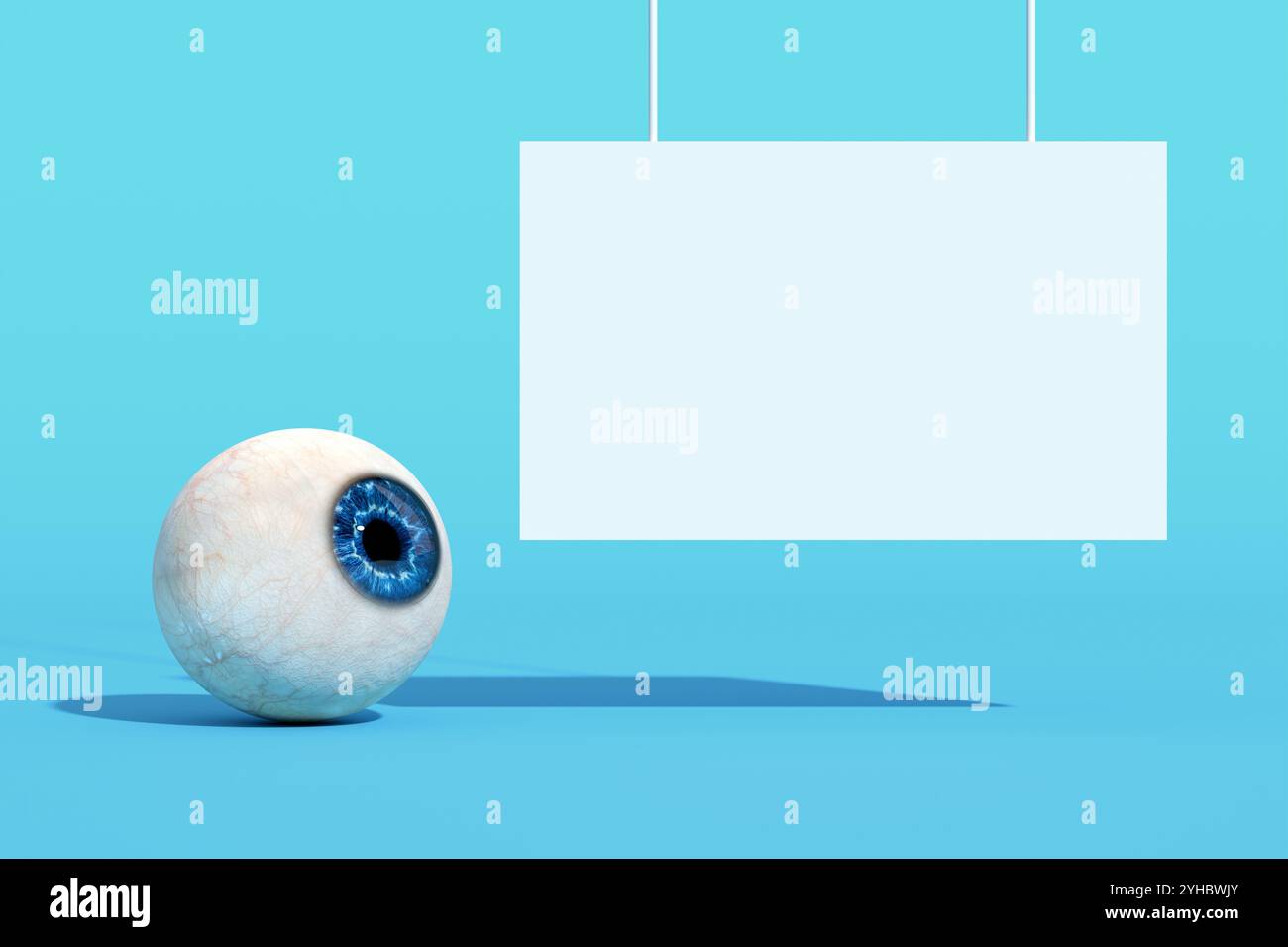 Human eyeball is staring at a blank white poster hanging on a blue ...