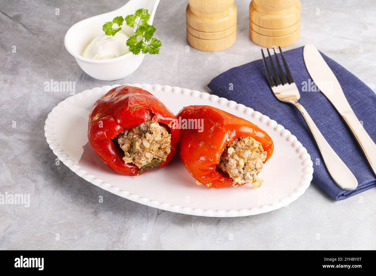 Stuffed bell pepper with minced meat and rice. Served sour cream Stock ...