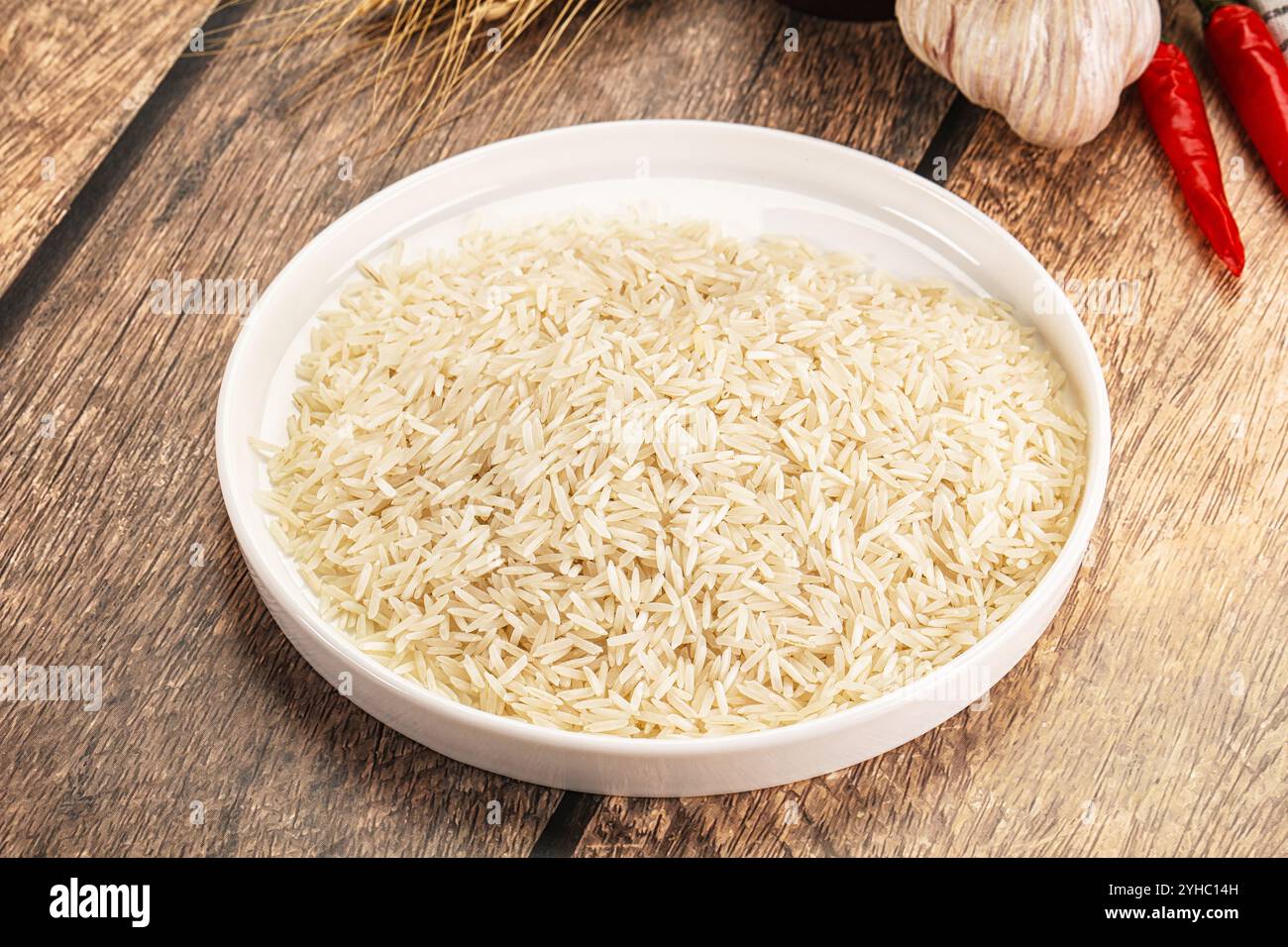 Indian cuisine - raw basmati rice for steam Stock Photo - Alamy