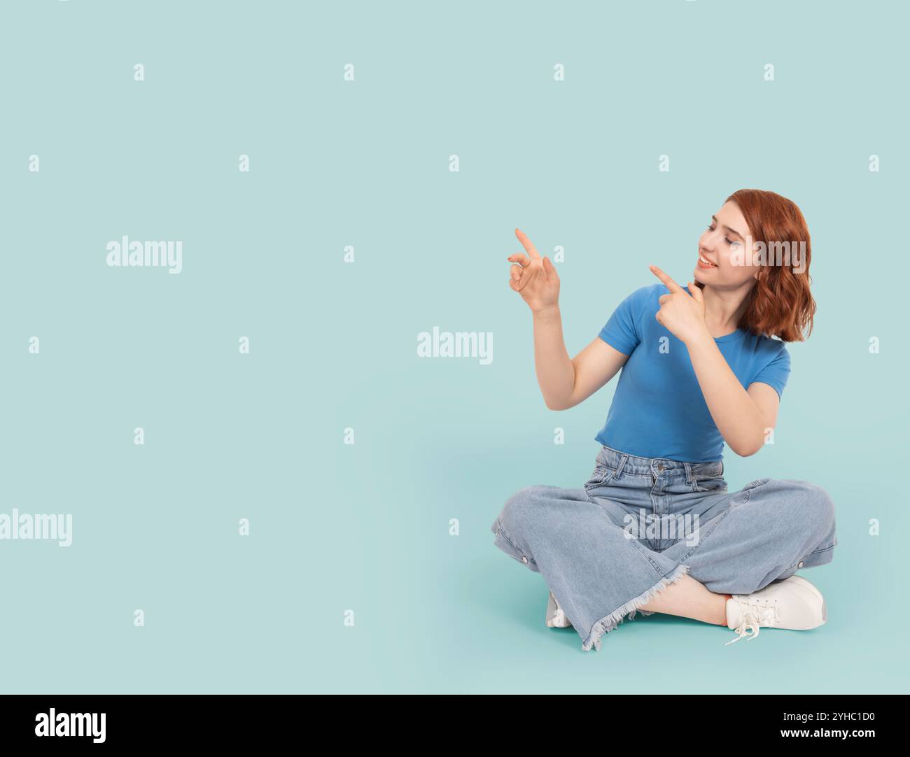 Pretty woman sitting legs crossed hi-res stock photography and images ...