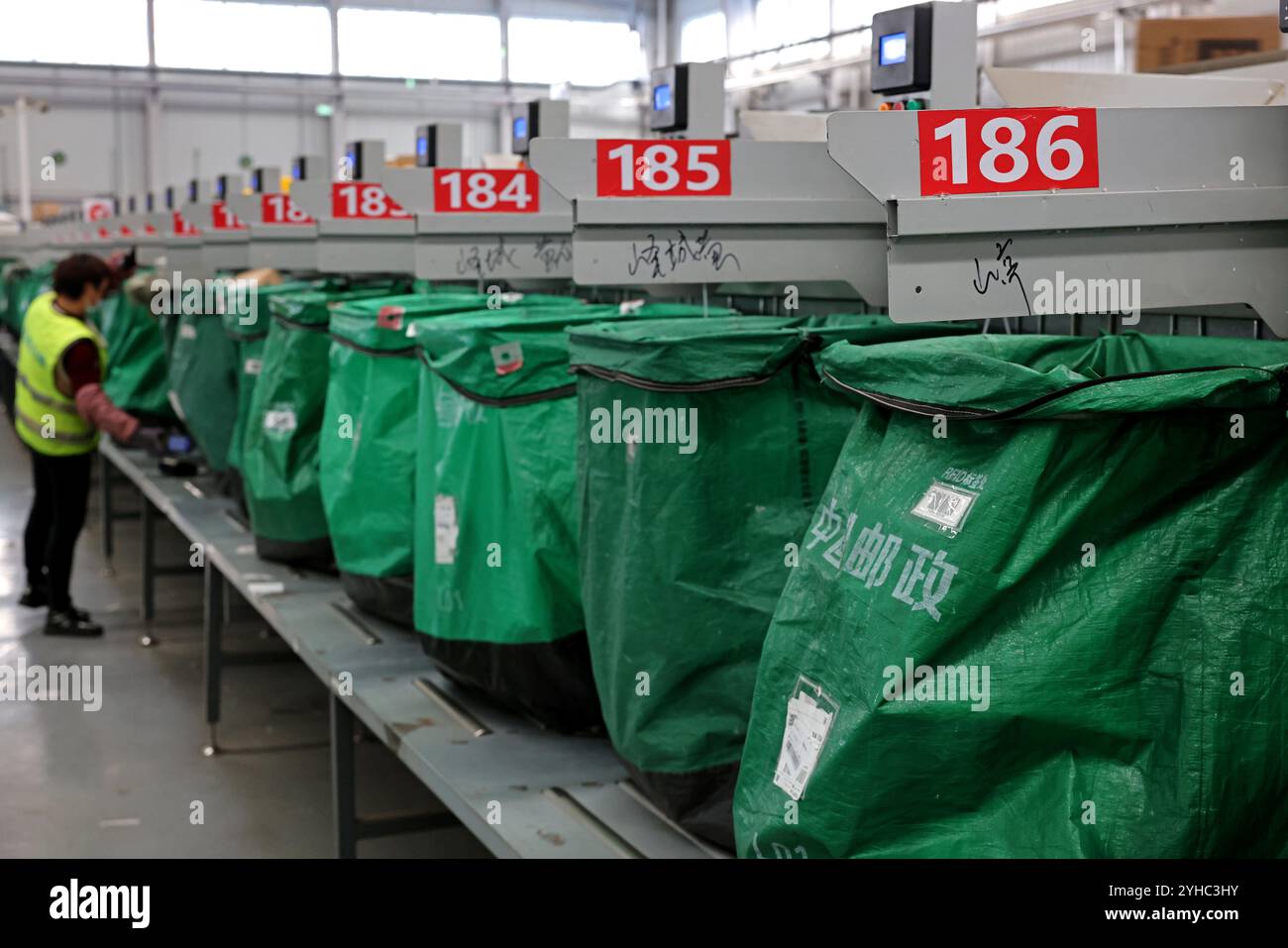 ZAOZHUANG, CHINA - NOVEMBER 11, 2024 - Staff work on an assembly line ...