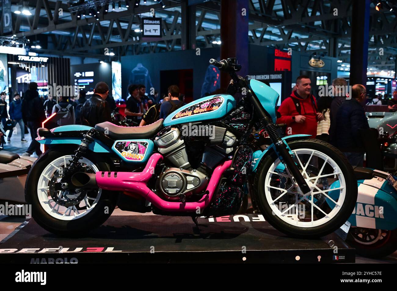 Visitors look at Harley-Davidson motorbikes on display at EICMA, the ...