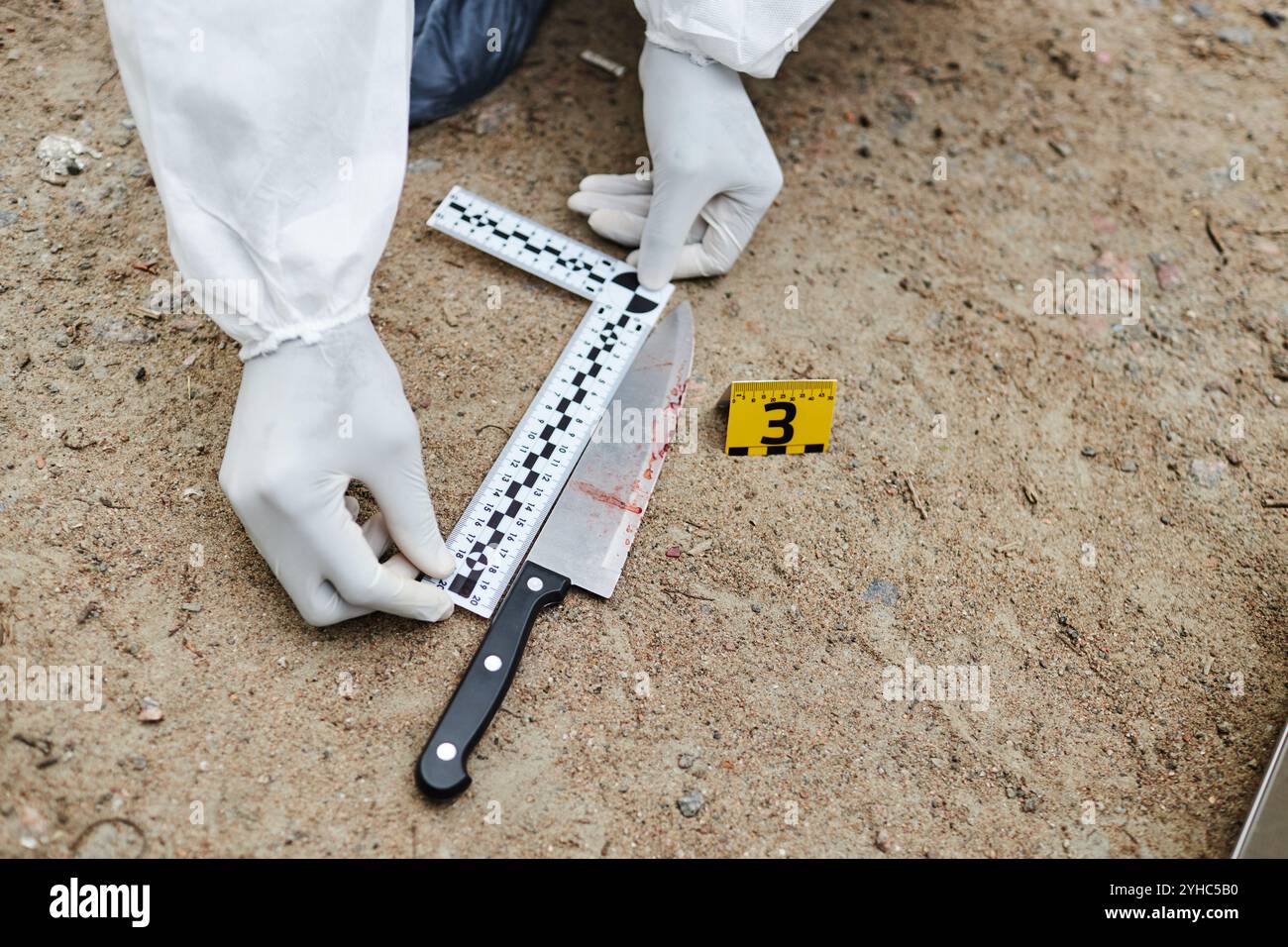 Top view closeup of unrecognizable person putting measuring tape next ...