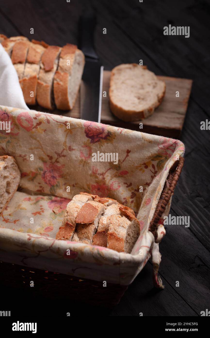 Rustic Bread Display with Sliced Whole Grain Loaf in Wicker Basket on ...