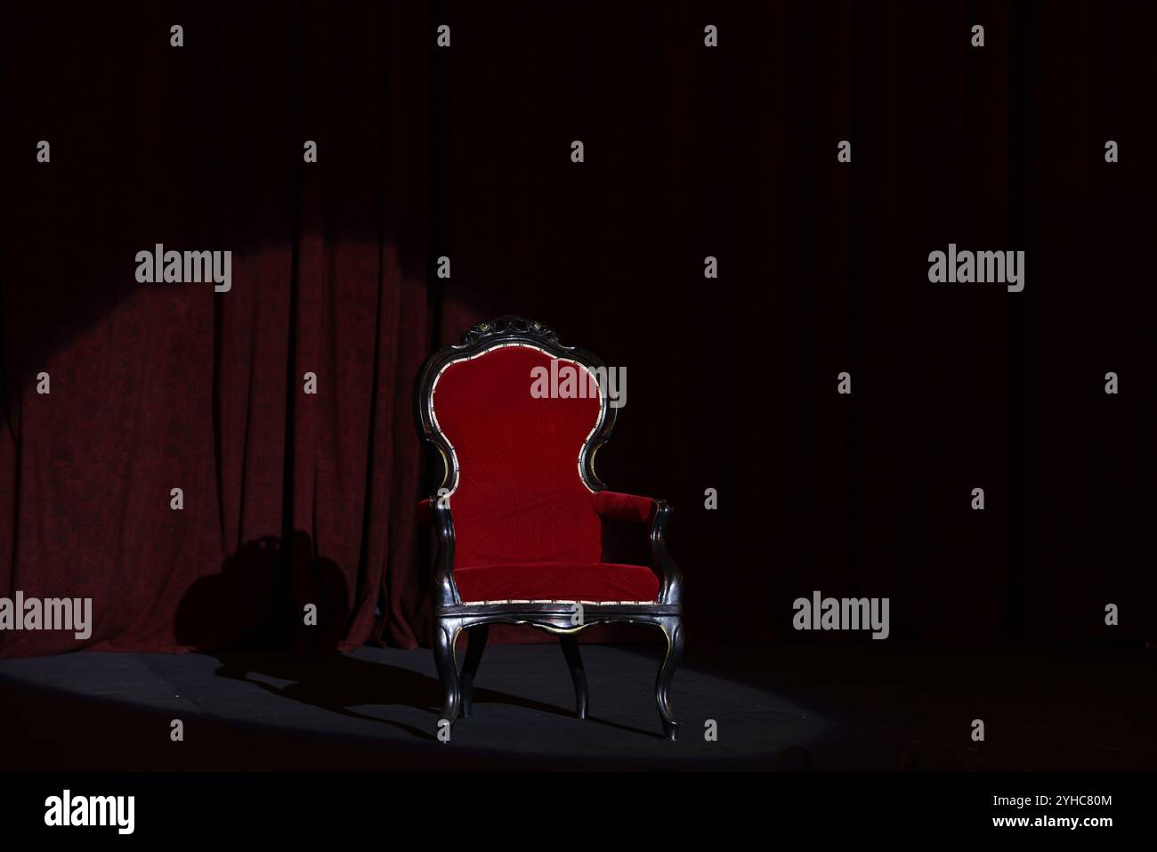 Vintage red armchair on stage in theatre Stock Photo - Alamy