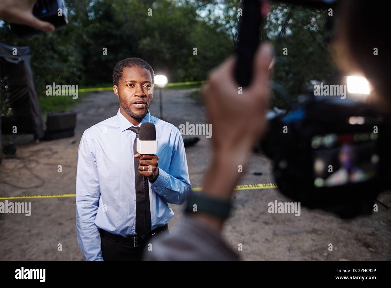 Policeman giving interview reporter outdoors hi-res stock photography ...
