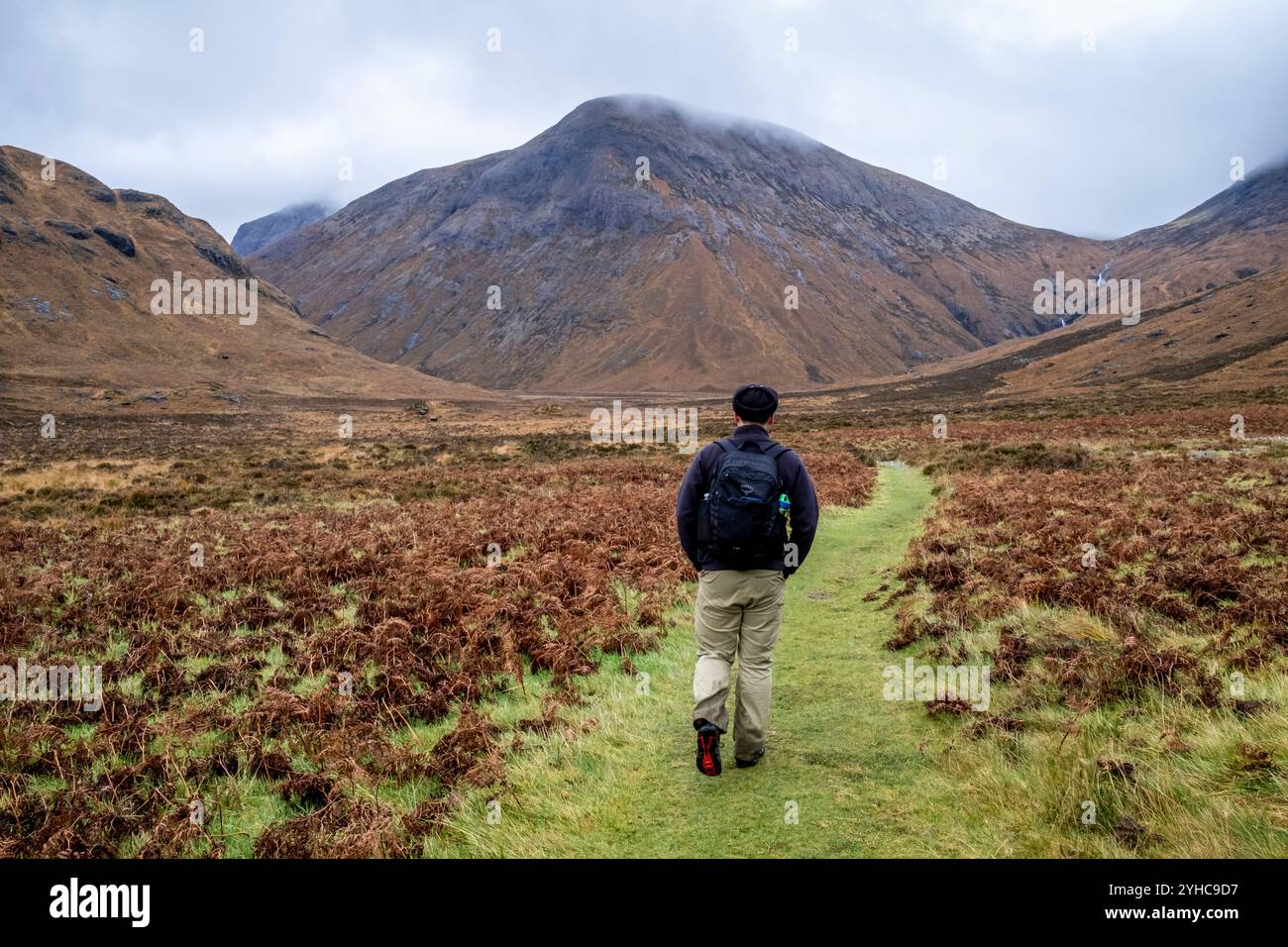 A Young Man Hiking Through The Cuillin Hiills/Mountains On The ...