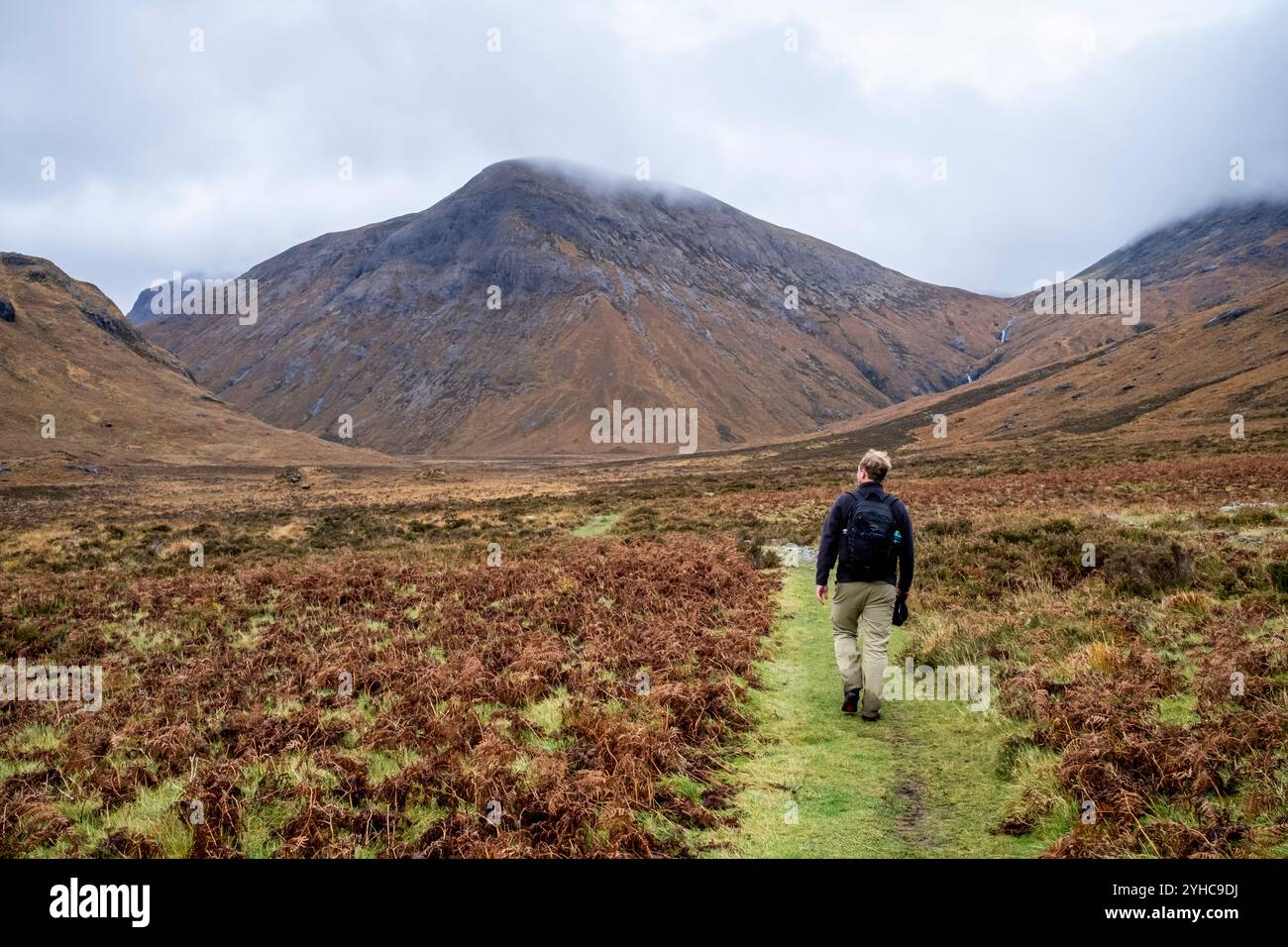 A Young Man Hiking Through The Cuillin Hiills/Mountains On The ...