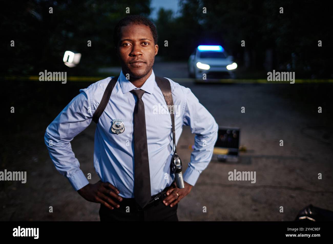 Policeman wearing uniform standing with hi-res stock photography and ...