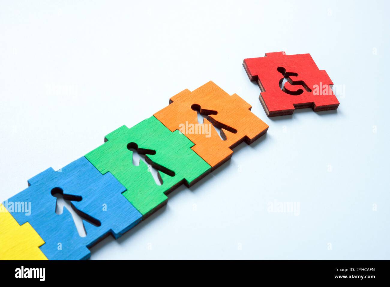 Colorful puzzle with disabled person sign added. Inclusion and ...