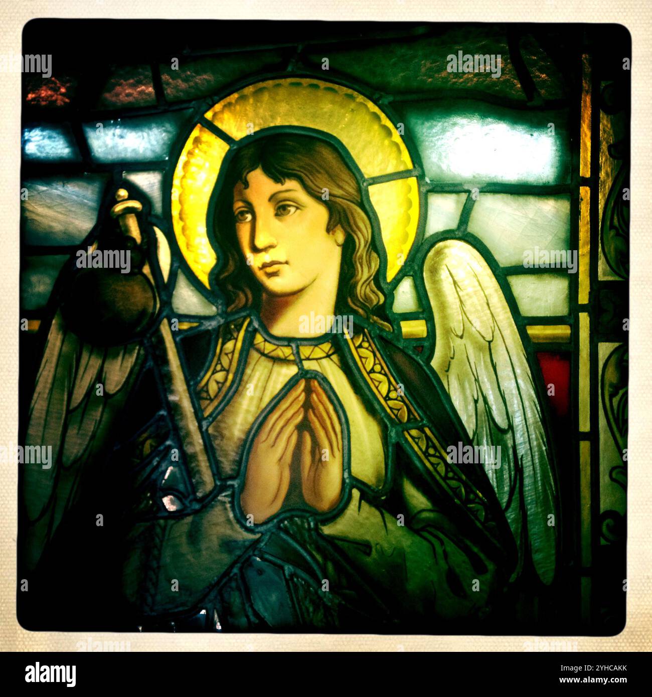 A stained glass window with the image of Saint Raphael Archangel in La ...