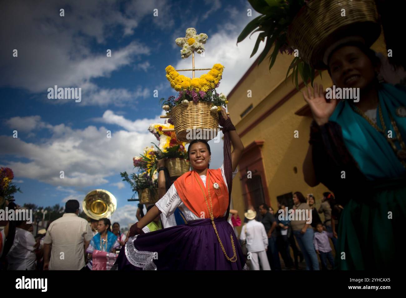 A 'china oaxaquena' dances balancing a basket of flowers on her head in ...