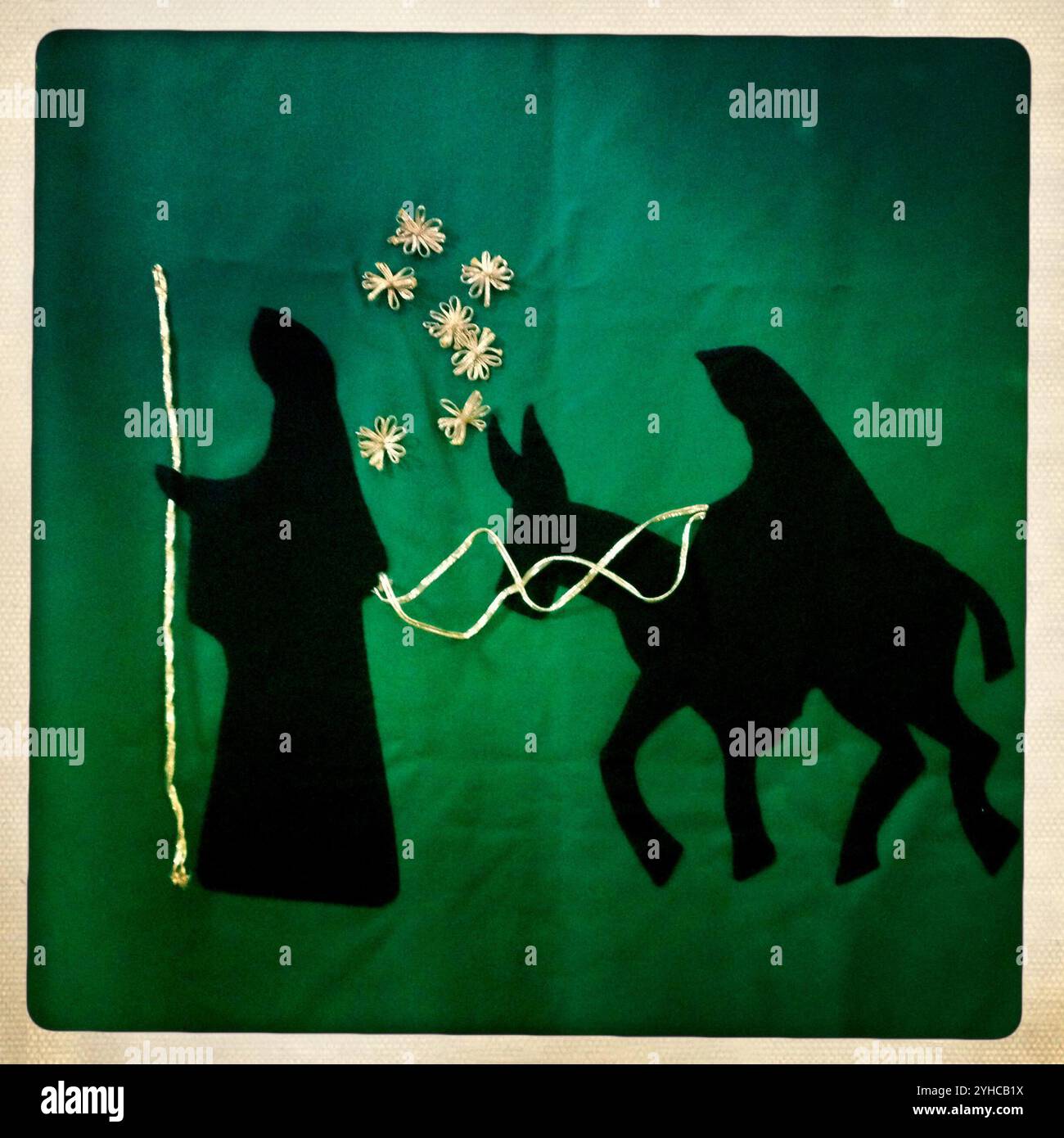 A banner with the embroidered figures of Saint Joseph and the Virgin ...