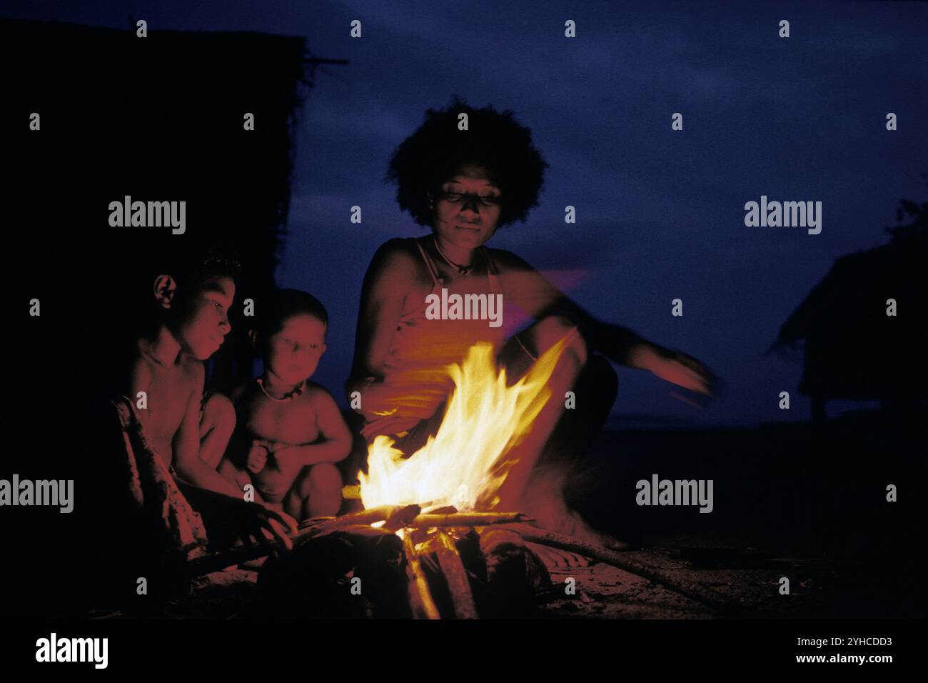 Woman cooking over fire hi-res stock photography and images - Alamy