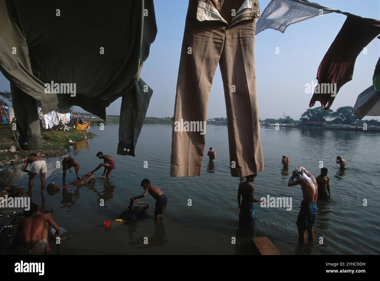Men bathing and washing clothes at the Ganges River Calcutta India ...