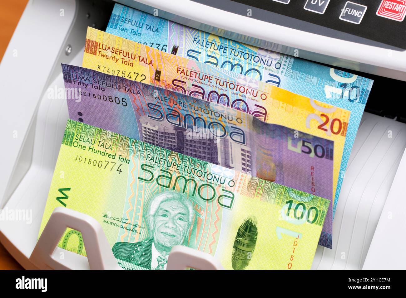 Samoan money - tala in the counting machine Stock Photo - Alamy