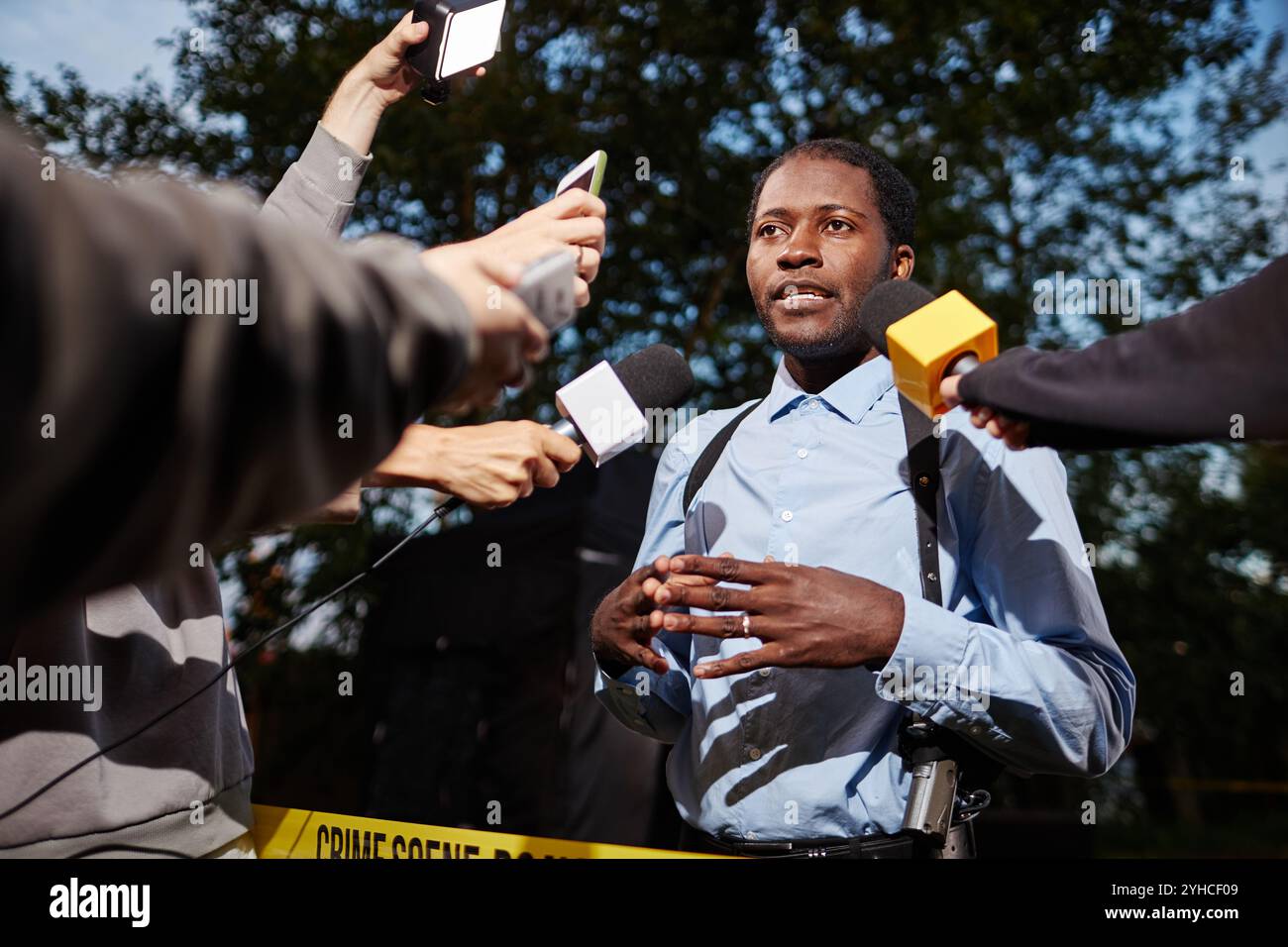 Low angle portrait of young African American man as police officer ...