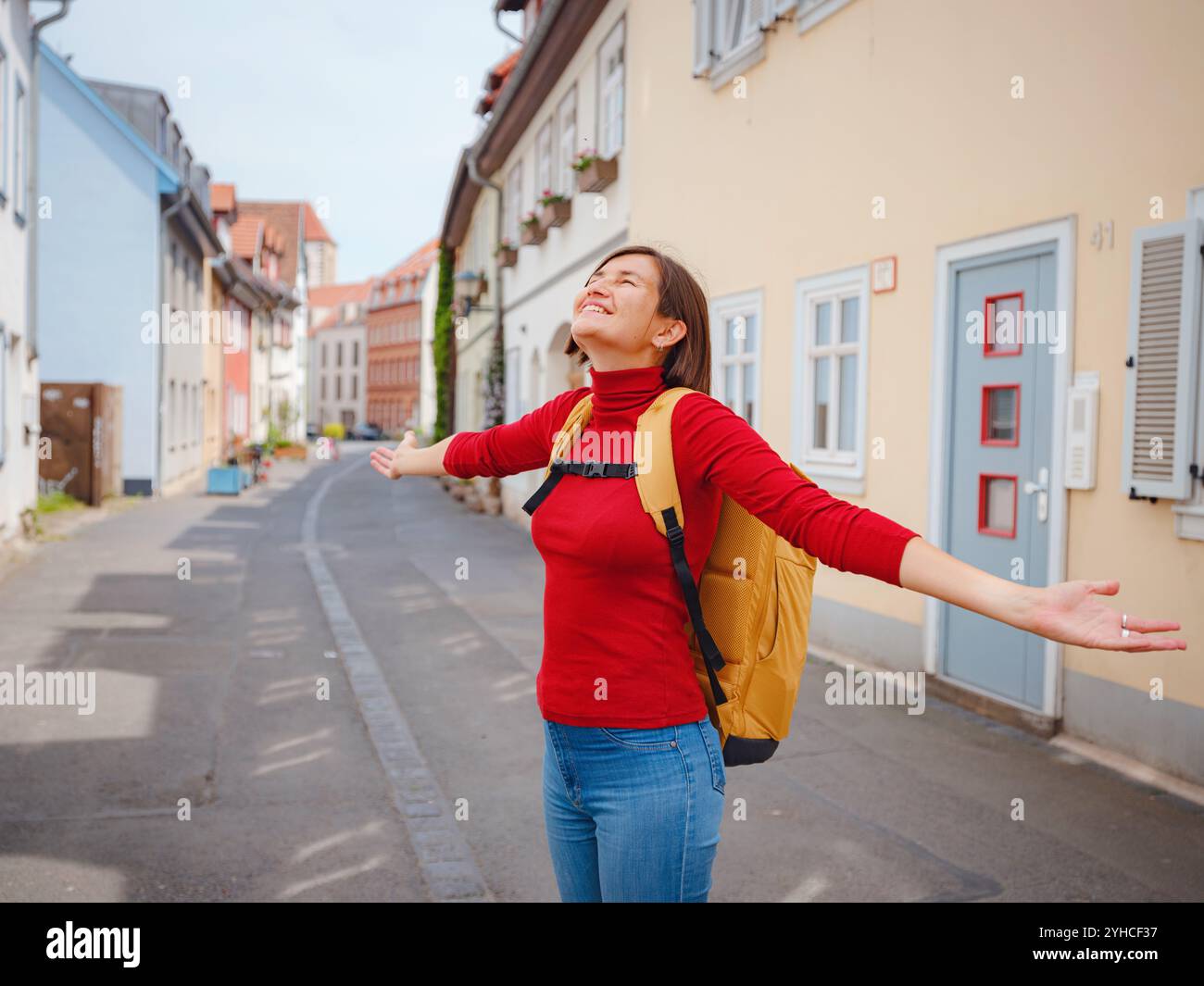 Tourist woman explores beautiful city of Erfurt, wandering through its ...
