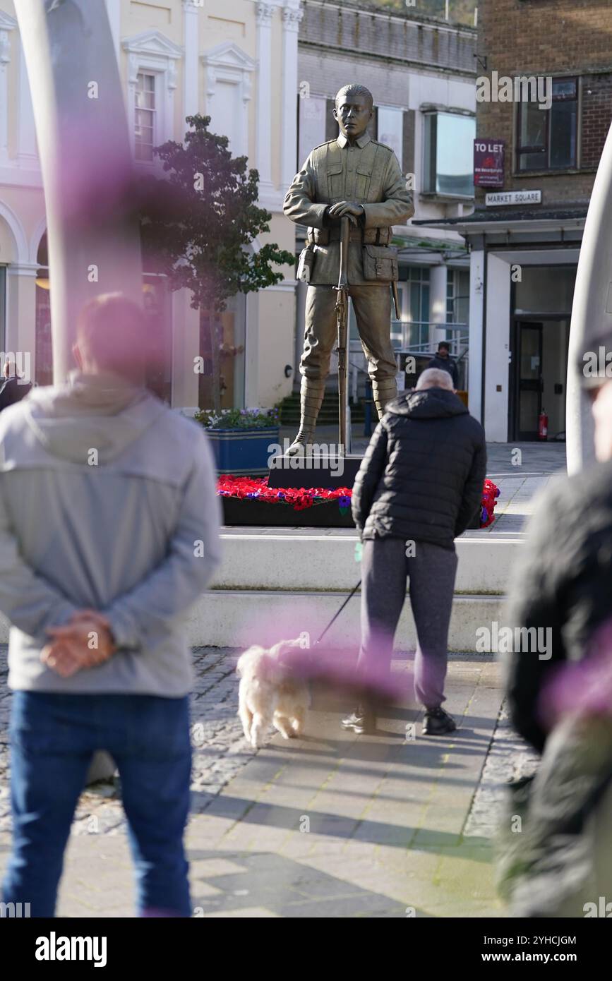 People stand by the First World War Soldier statue in Market Square in ...