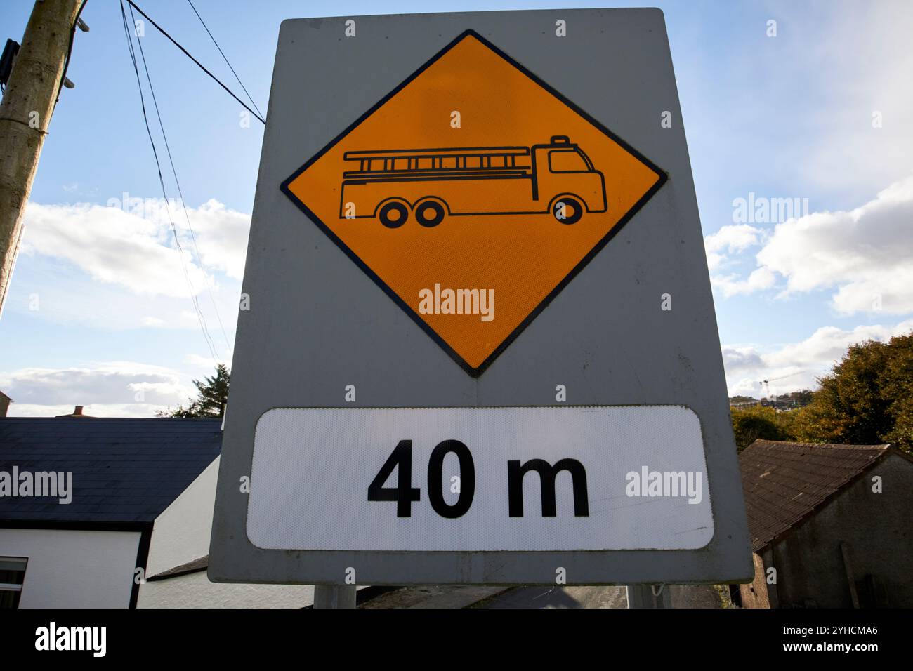 orange diamond warning sign for fire station 40m ahead moville, county ...