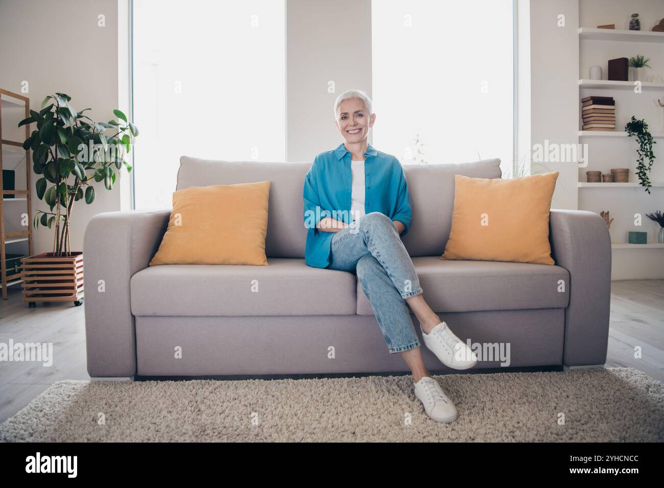 Full body photo of nice retired female sit couch relaxed smiling wear ...