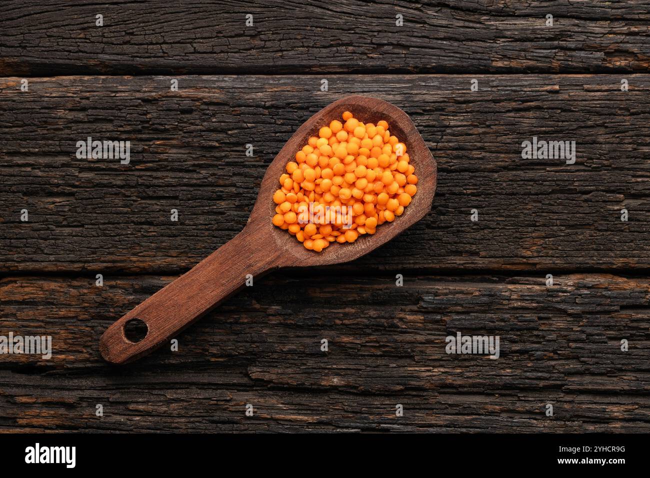 Red lentils on the spoon - Lens culinaris organic Stock Photo - Alamy