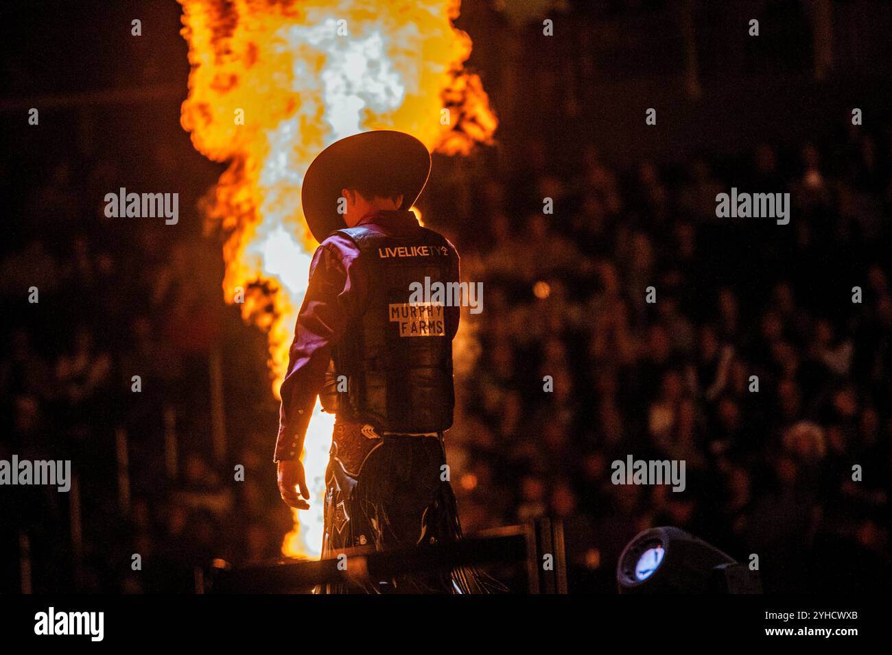 The bull Riders enter the ring with pyrotechnics prior to the ...