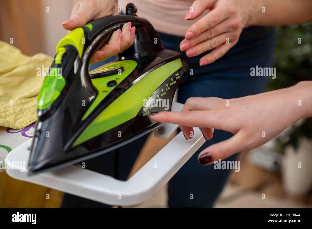 Hands Showcasing Various Ironing Techniques on Different Types of ...
