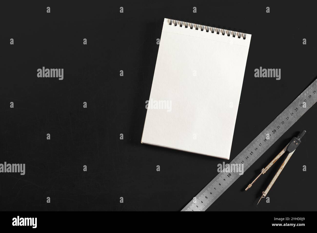 Engineering compass with white paper Stock Photo - Alamy