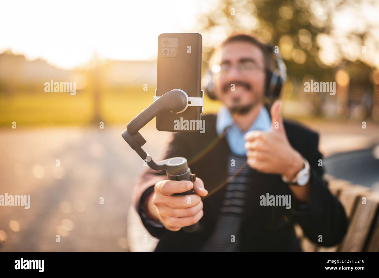 Smiling vlogger showing thumb hi-res stock photography and images - Alamy