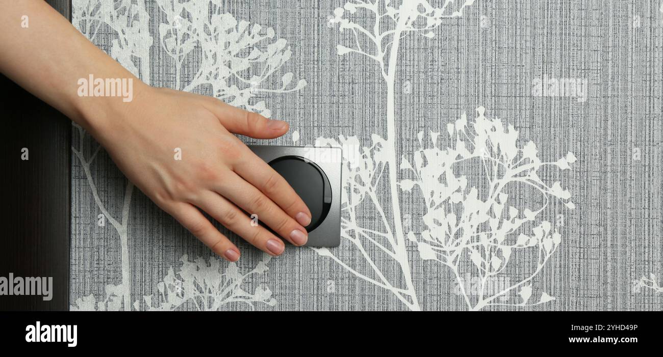 Energy saving light switch woman hi-res stock photography and images ...