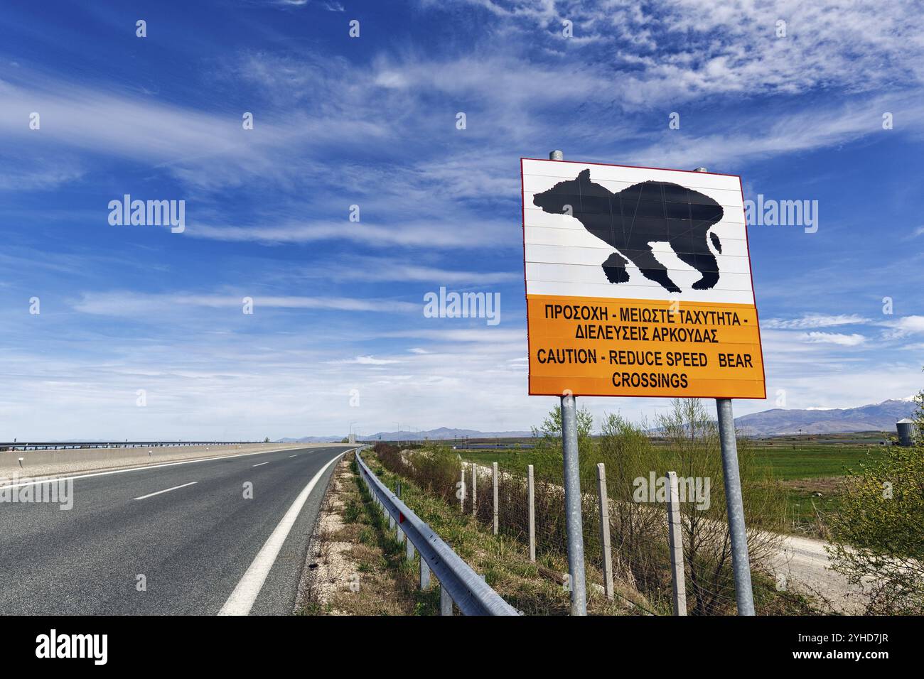 Bilingual warning sign on motorway, caution, drive slowly, bears ...