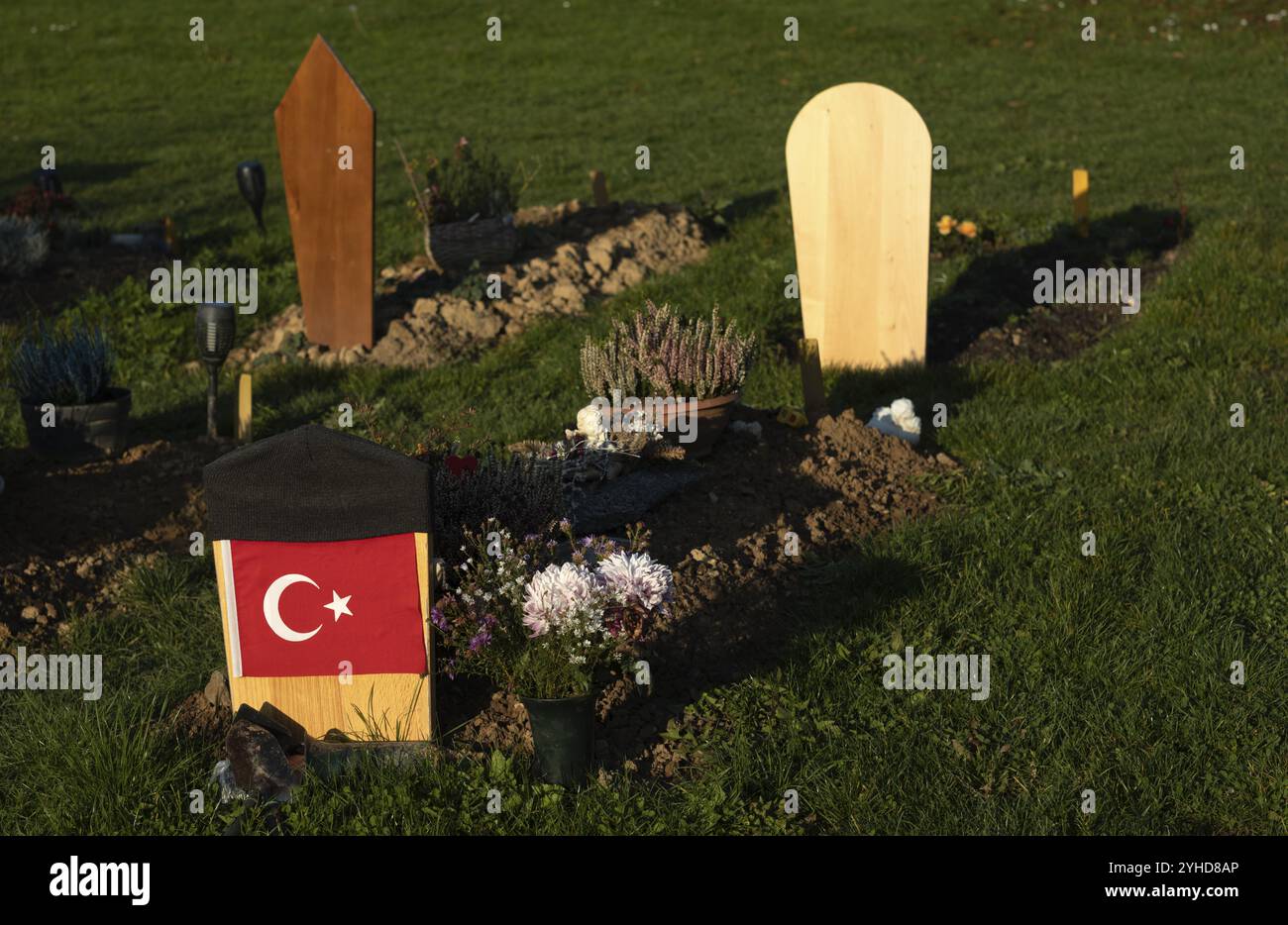 Muslim graves strictly orientated towards Mecca, national flag of ...