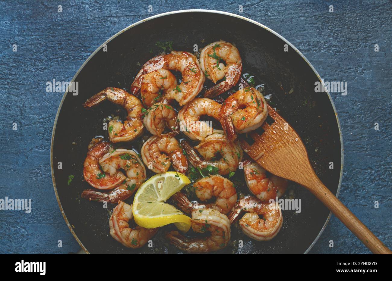 Fried tiger prawns, jumbo, in garlic sauce, in butter, with herbs, in a ...
